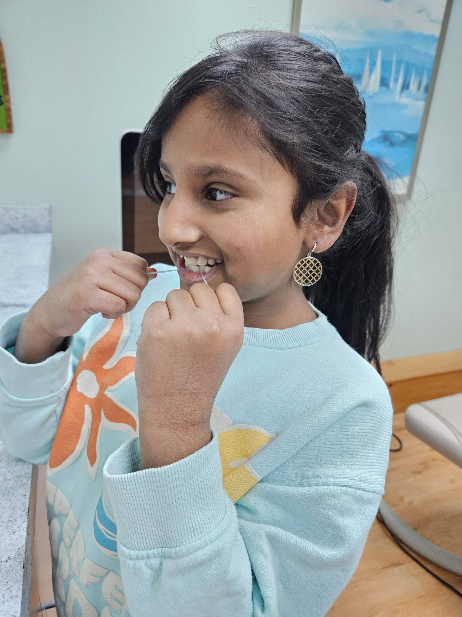 Kids Flossing - Christenson Family Orthodontics